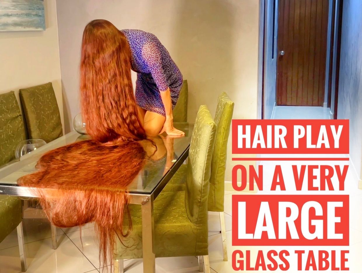 Hair play on a very large glass table